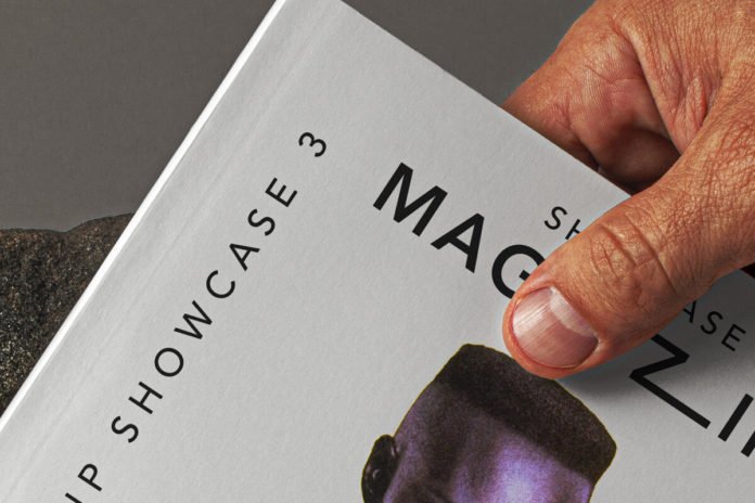 Hand Holding Free Magazine Mockup Showcase PSD Template | Mockup Den
