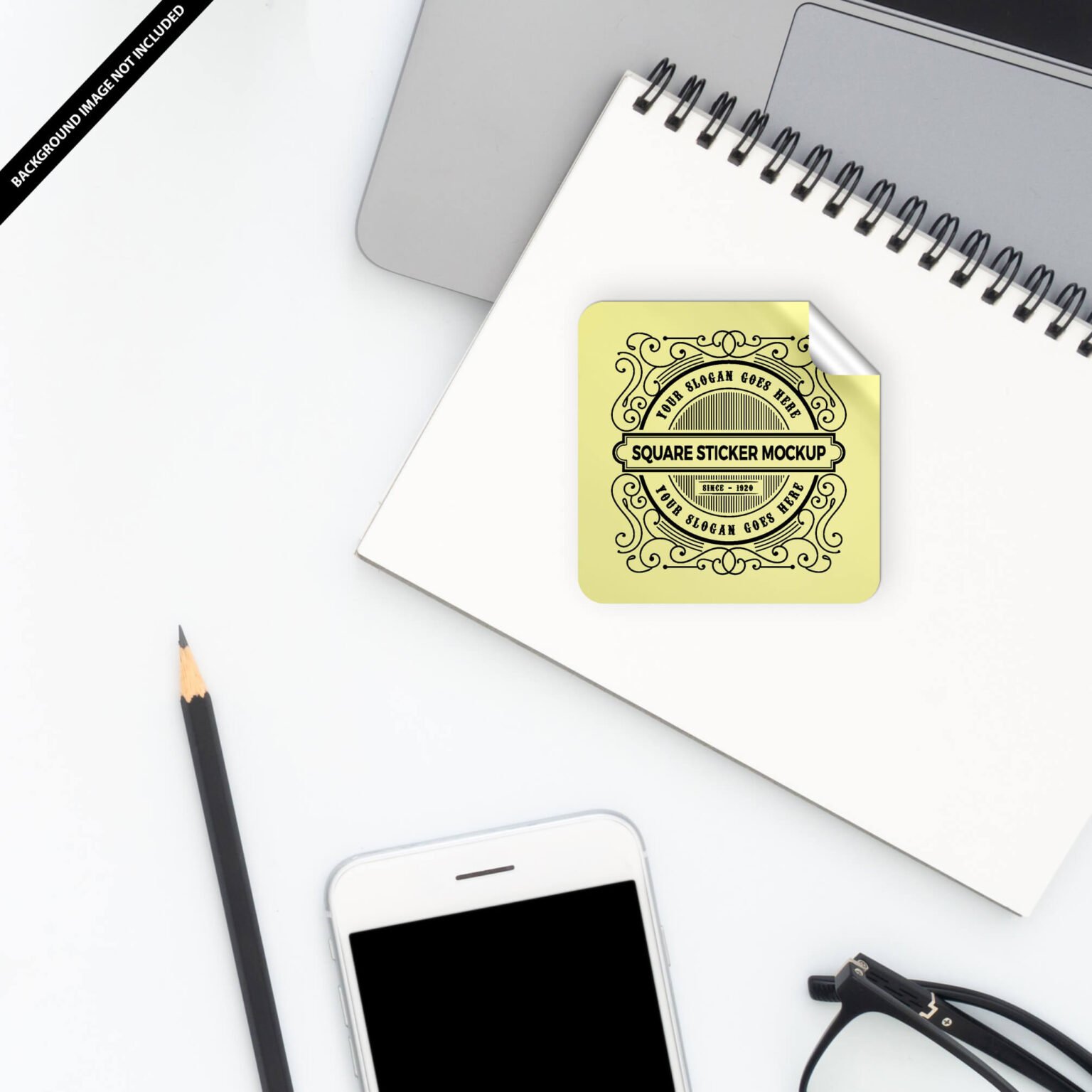 Free Square Sticker On a Notebook Mockup PSD Template - Mockup Den